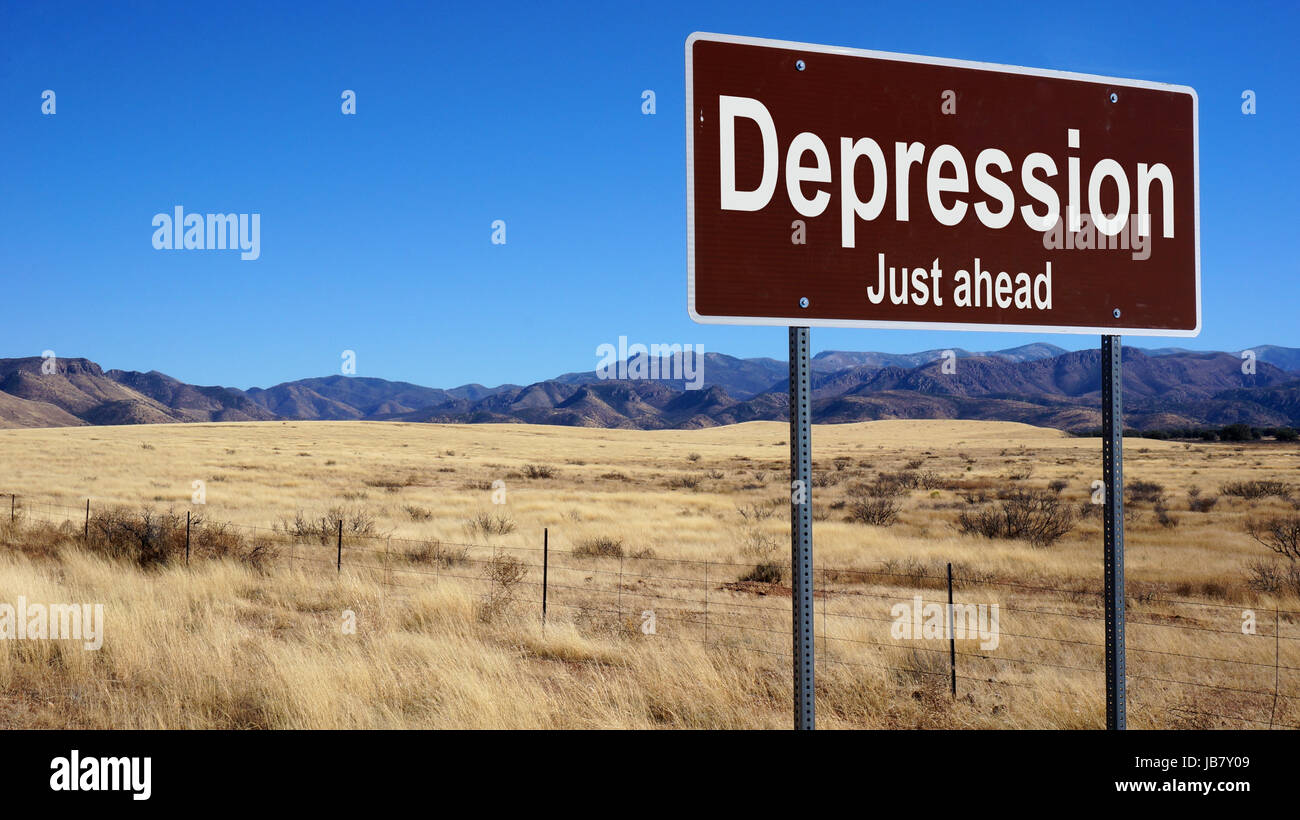 Depression road sign with blue sky and wilderness Stock Photo - Alamy