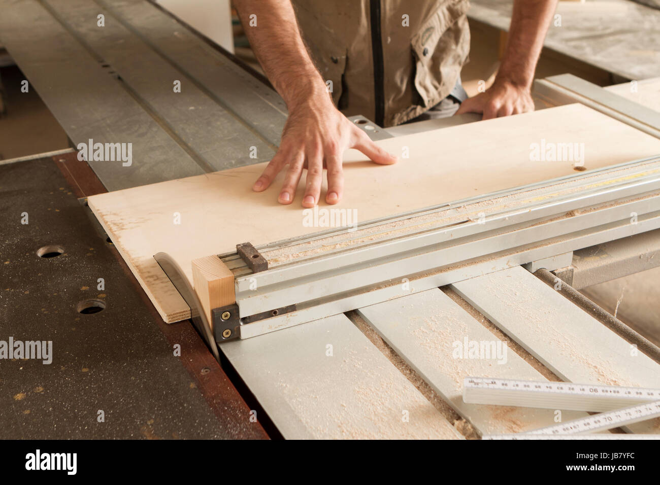 hands of a worker while cutting with circular saw Stock Photo - Alamy