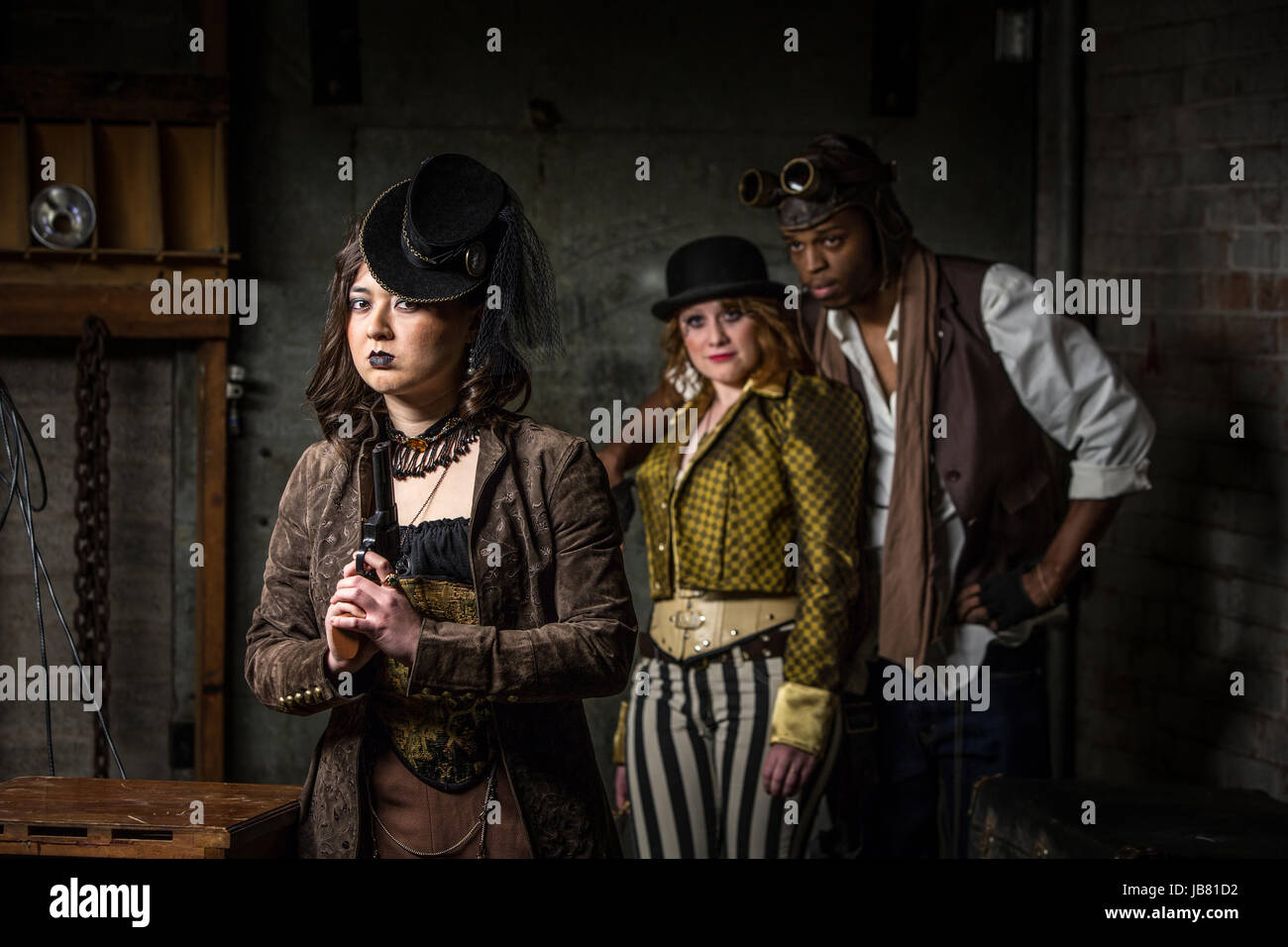 Three Steampunks with in Underground Retro Lab Stock Photo - Alamy