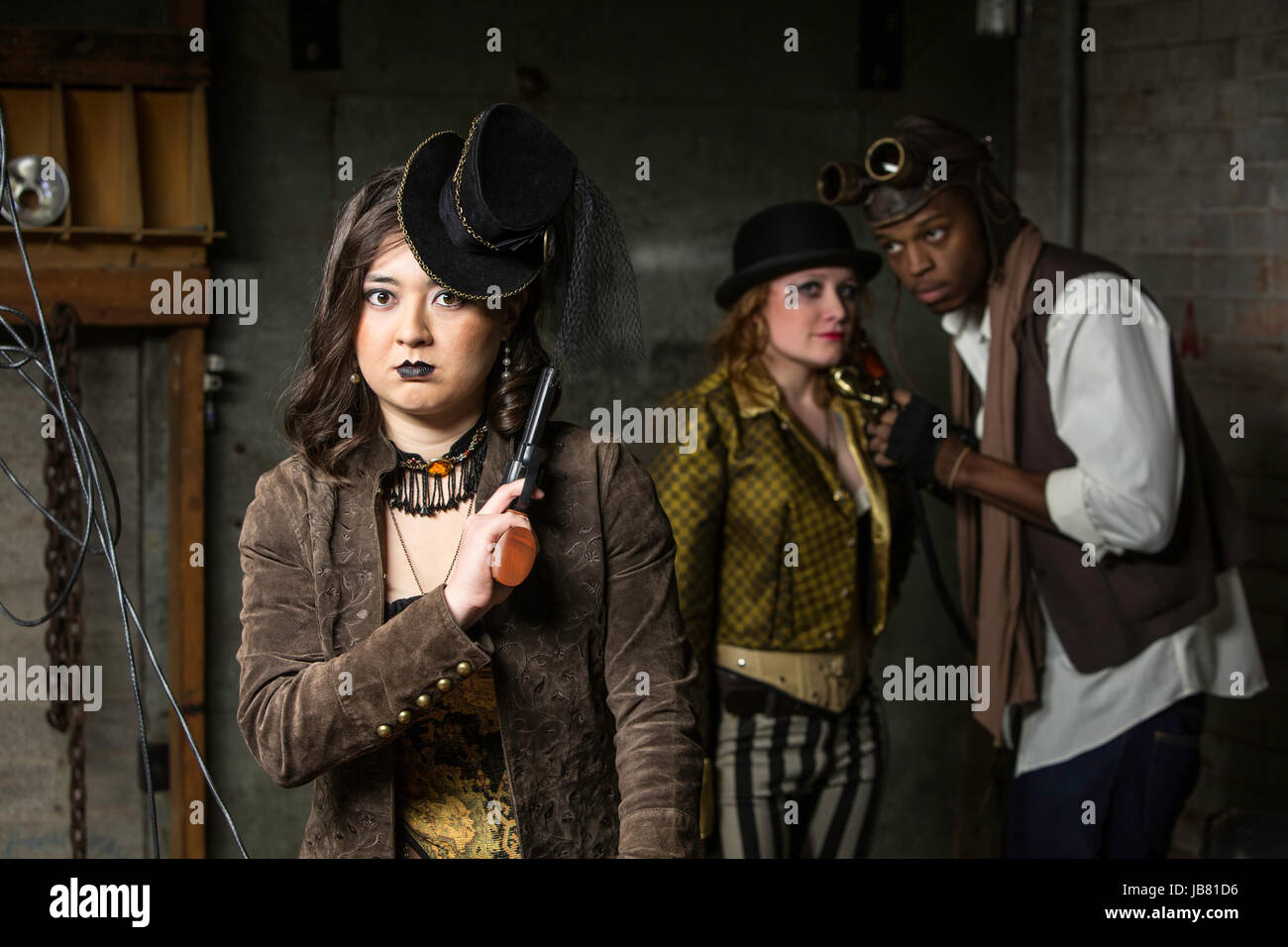 Young Steam Punks PosIng in Underground Lair Stock Photo - Alamy