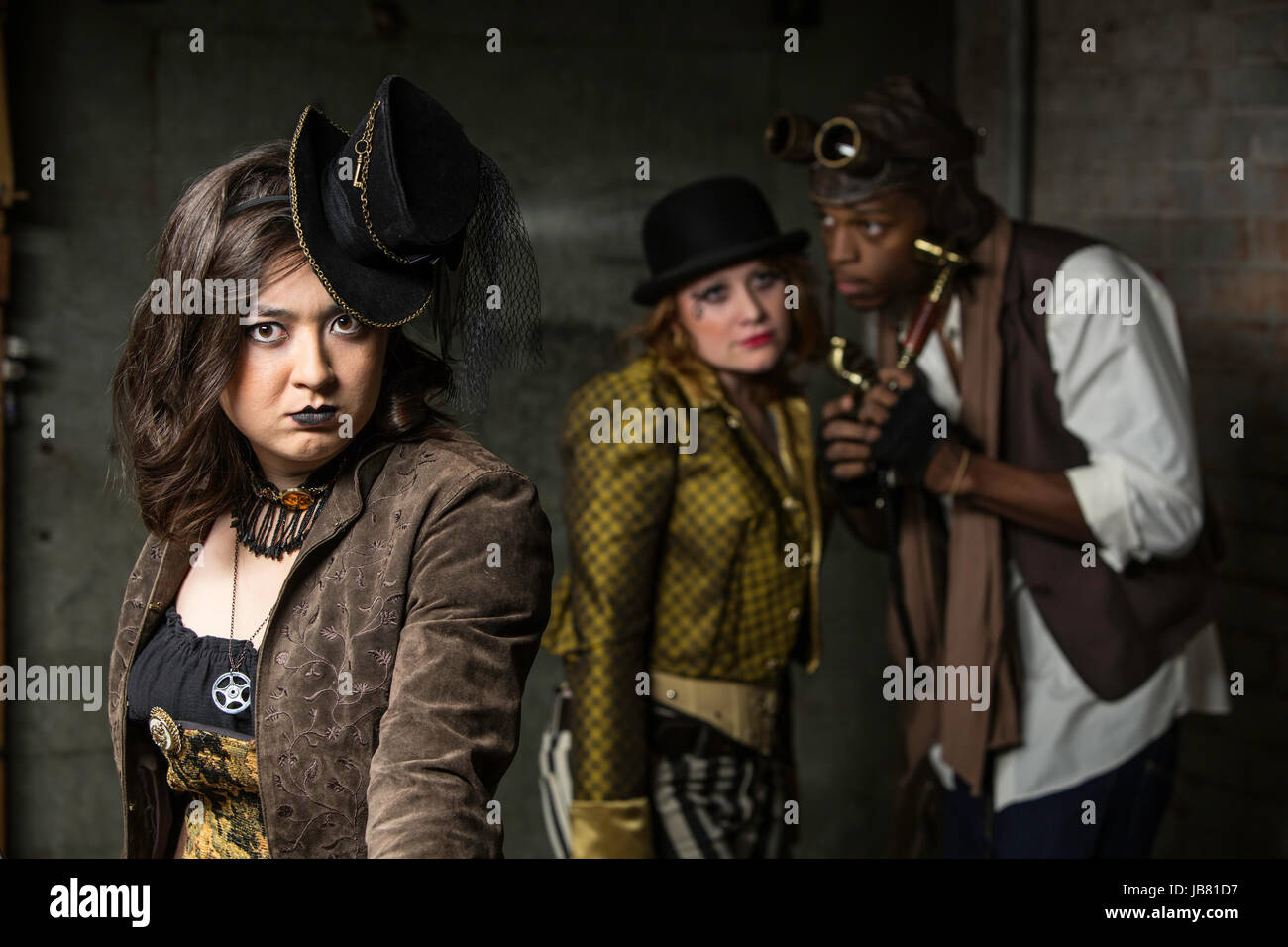 Young Steam Punks PosIng in Underground Lair Stock Photo - Alamy