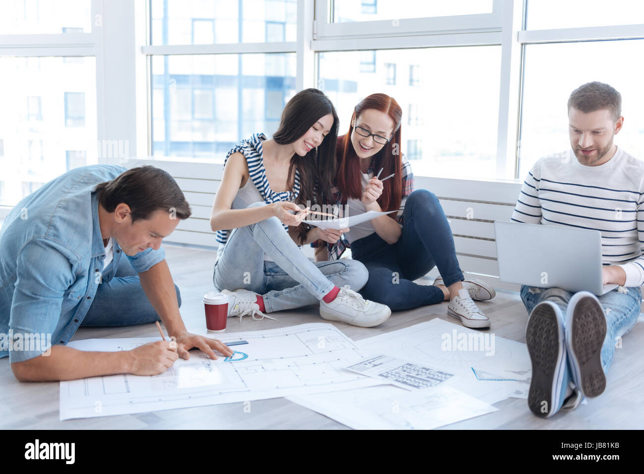 Cheerful female architects discussing their ideas Stock Photo - Alamy