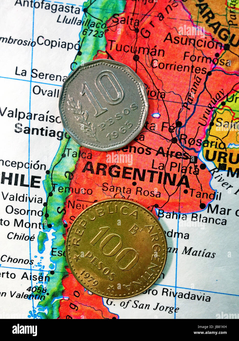 Coins on World Map Still Life Stock Photo - Alamy