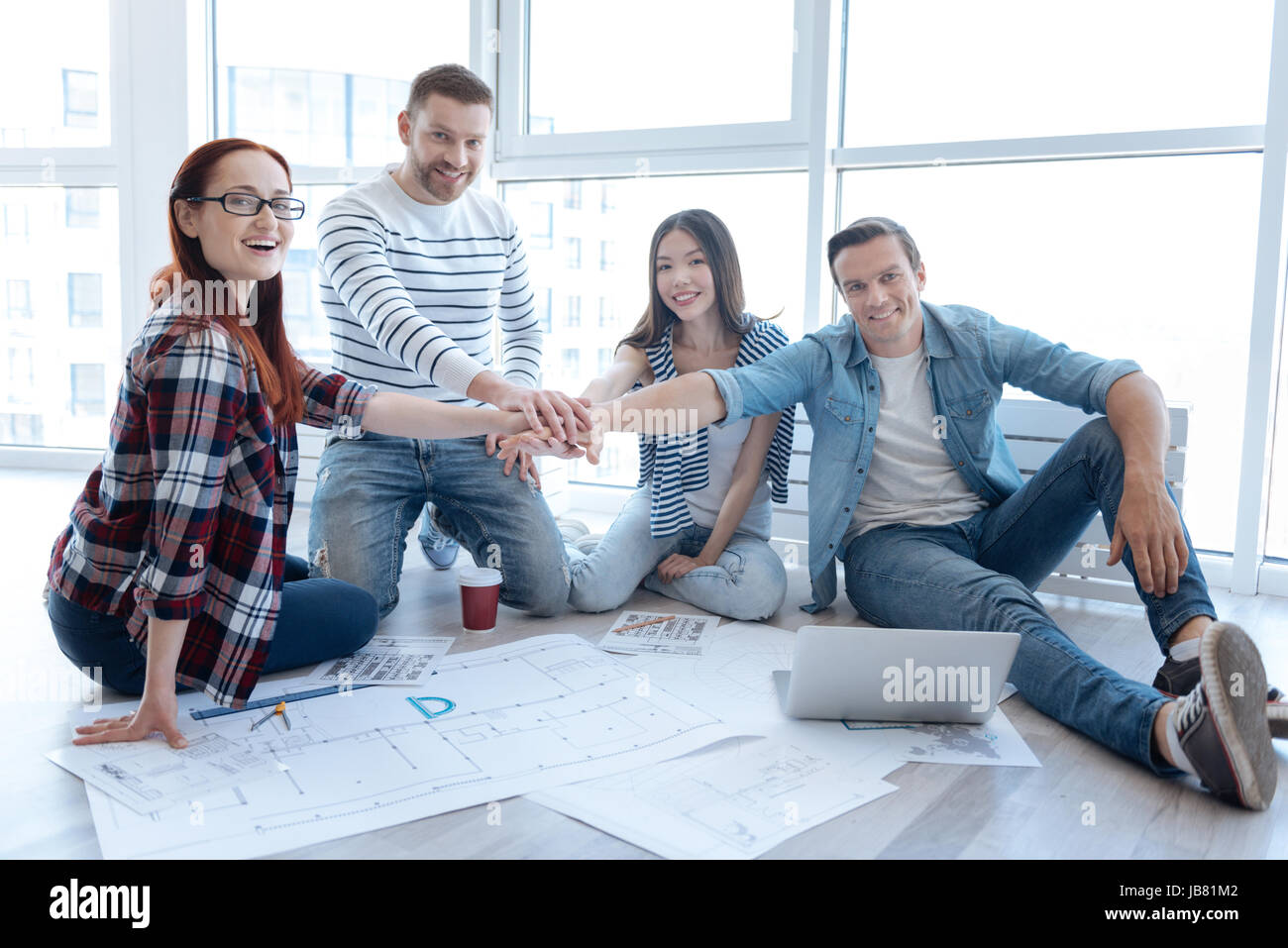 Delighted happy people showing their unity Stock Photo - Alamy