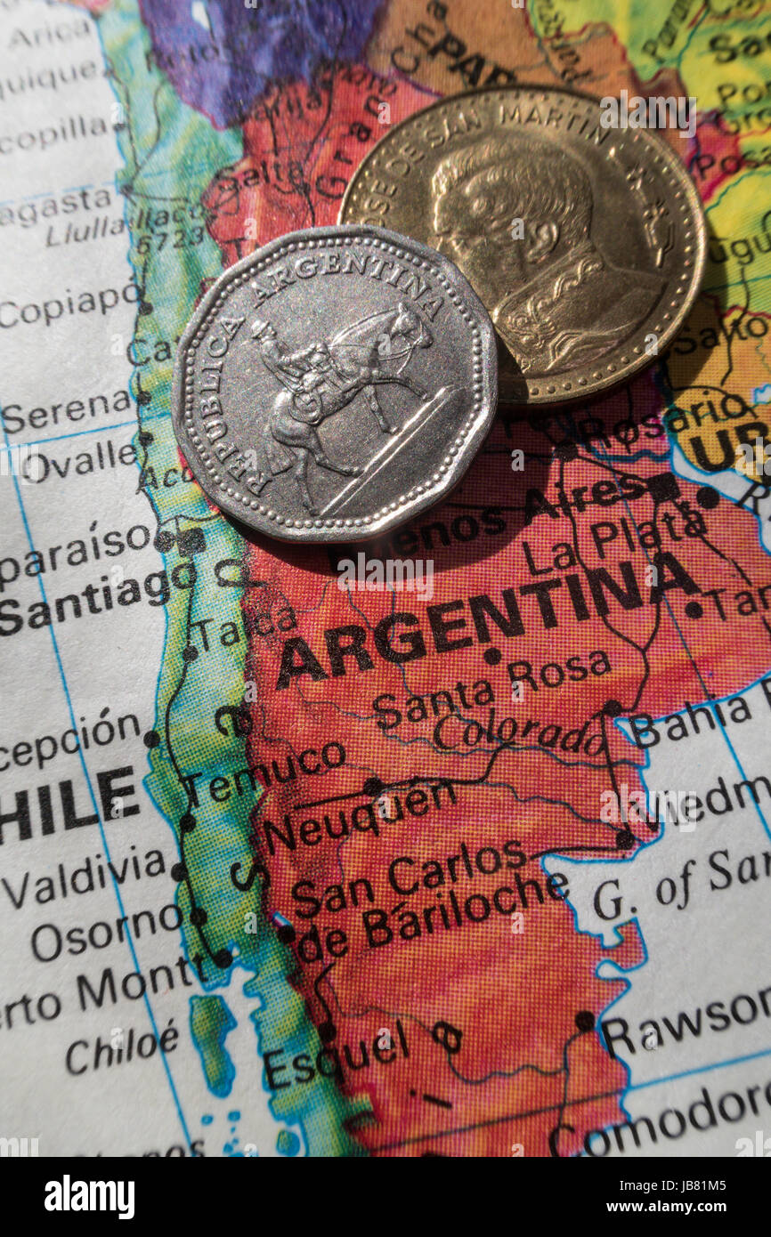 Coins on World Map Still Life Stock Photo - Alamy