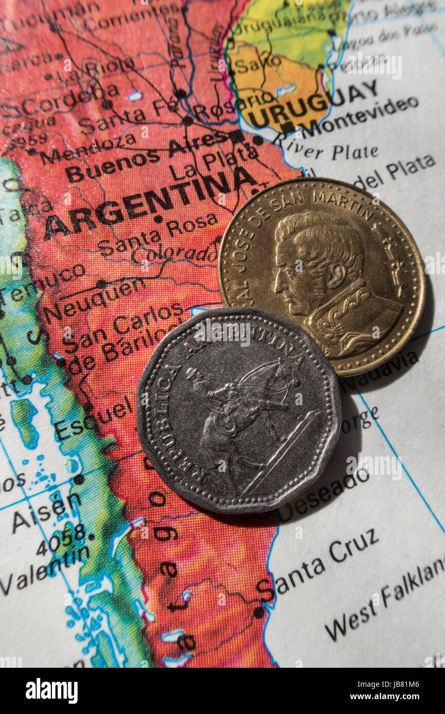 Coins on World Map Still Life Stock Photo - Alamy