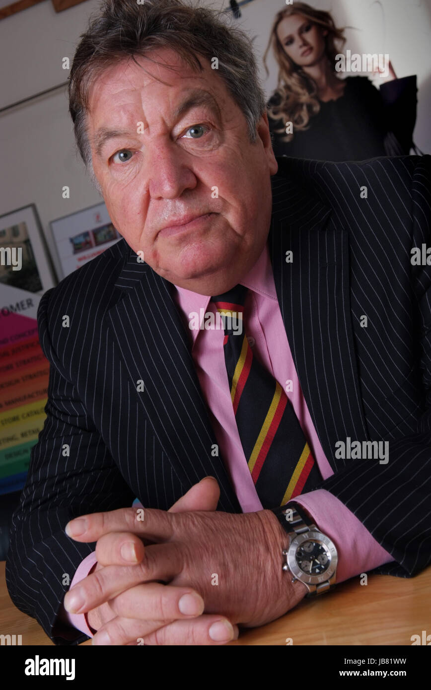 Fashion designer George Davies in his office/studio Stock Photo - Alamy