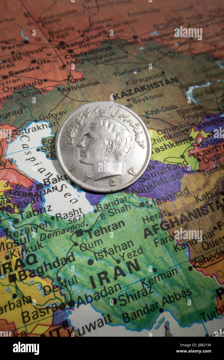 Iranian Coin on World Map Still Life Stock Photo - Alamy