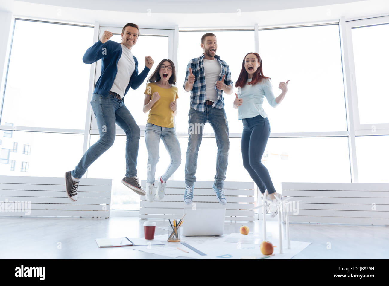 Joyful happy people jumping together Stock Photo - Alamy