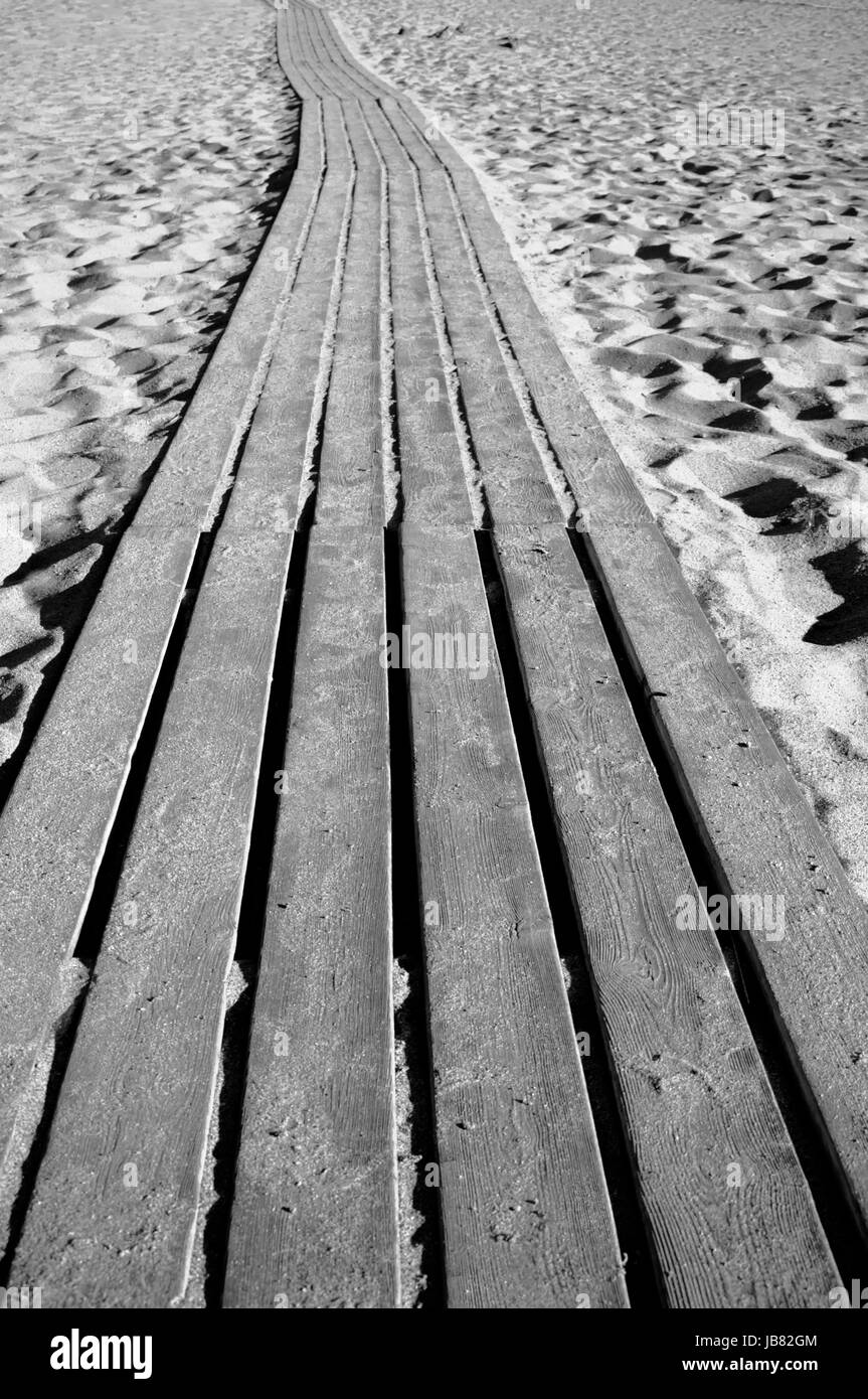 Wooden path through a sandy beach, Greece Stock Photo - Alamy