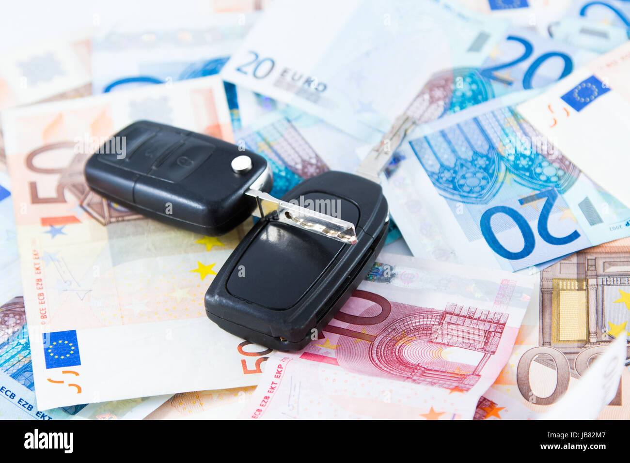 Car key on money background Stock Photo - Alamy