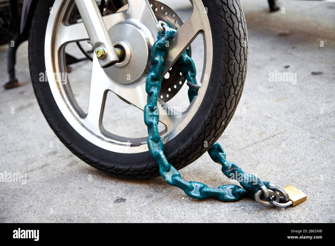 Protection lock on bike in street Stock Photo - Alamy