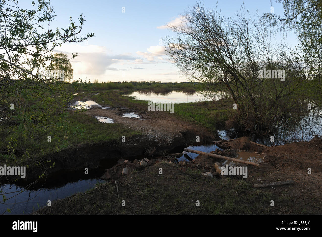 Road broken during the high water on the countryside Stock Photo - Alamy