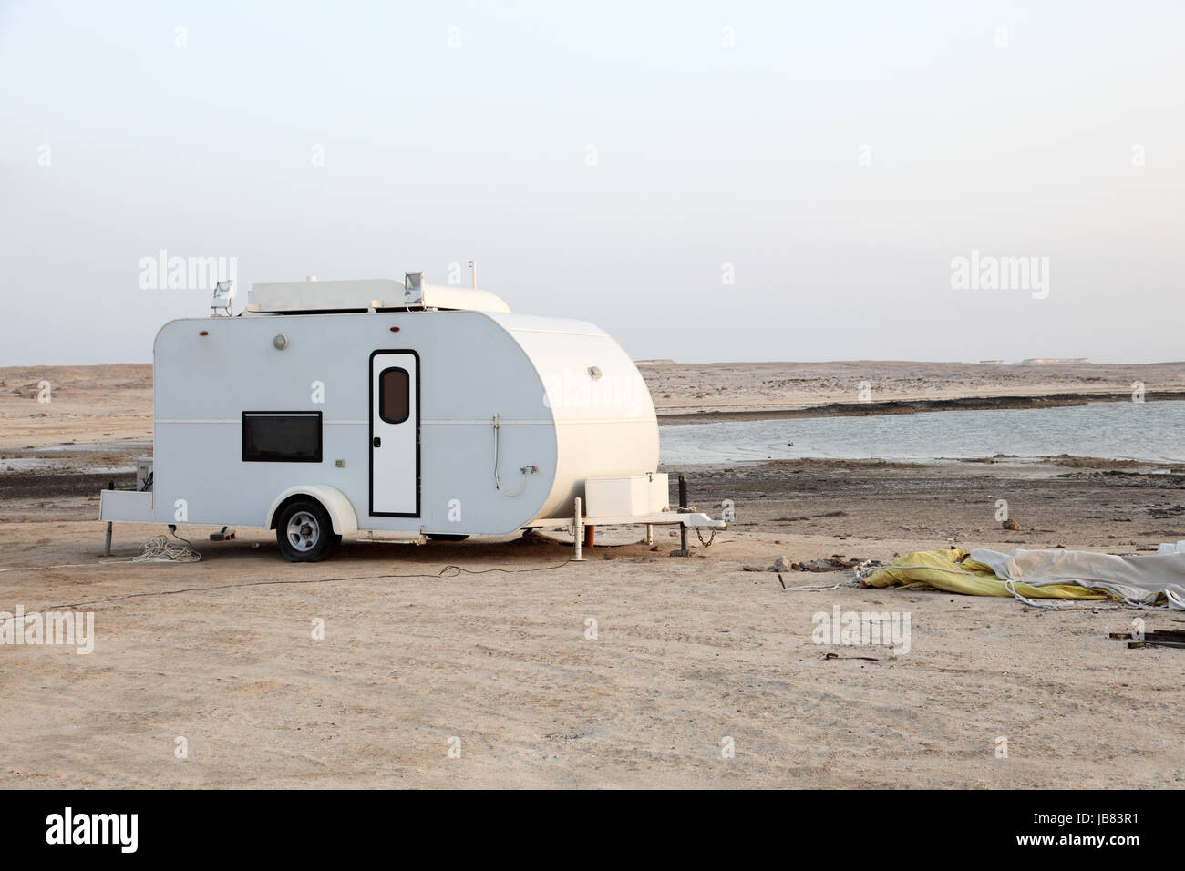 Trailer on the beach of Arabian Gulf in Qatar Stock Photo - Alamy