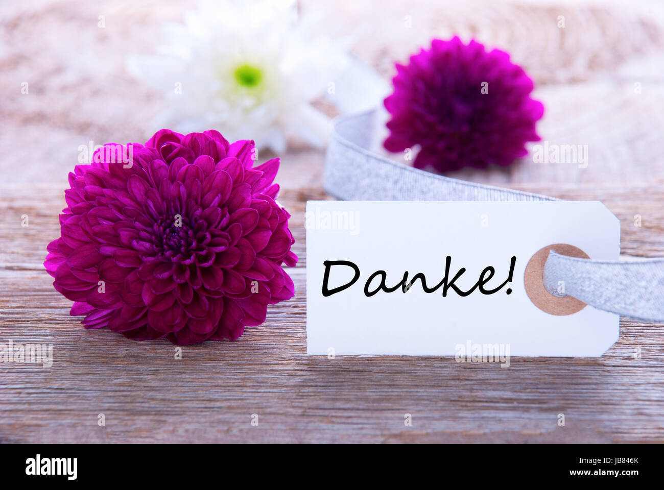 Label with the German Word Danke which means Thanks and Purple Flowers ...