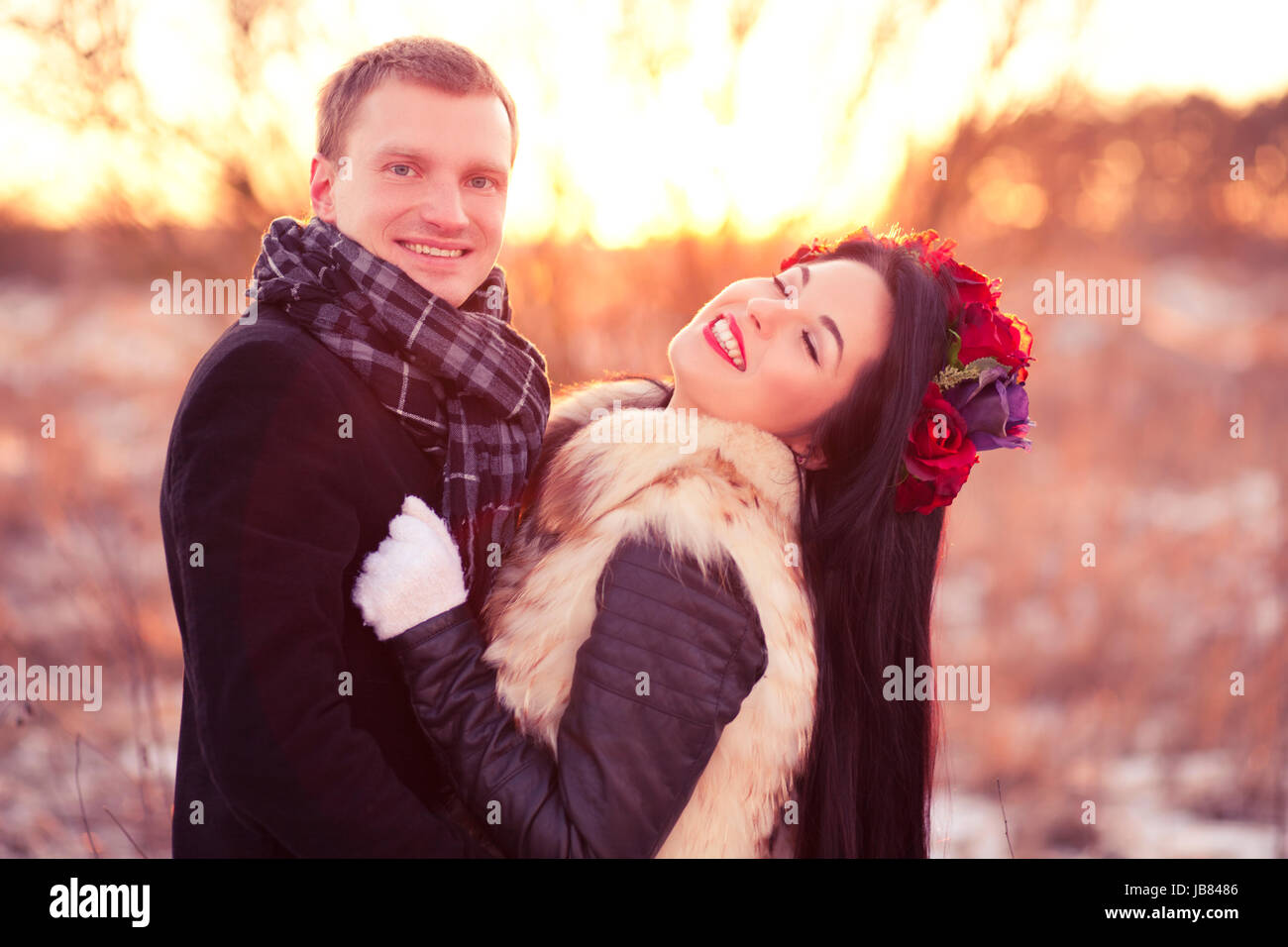 Cheerfull young lovers are smiling and hugging in sunlight Stock Photo ...