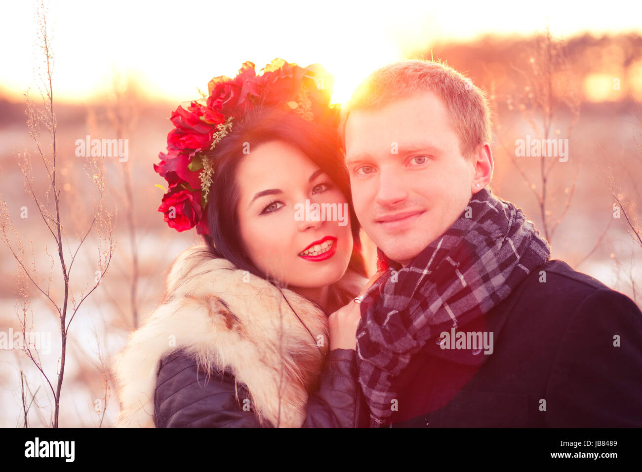 Cheerfull young lovers are smiling and hugging in sunlight Stock Photo ...