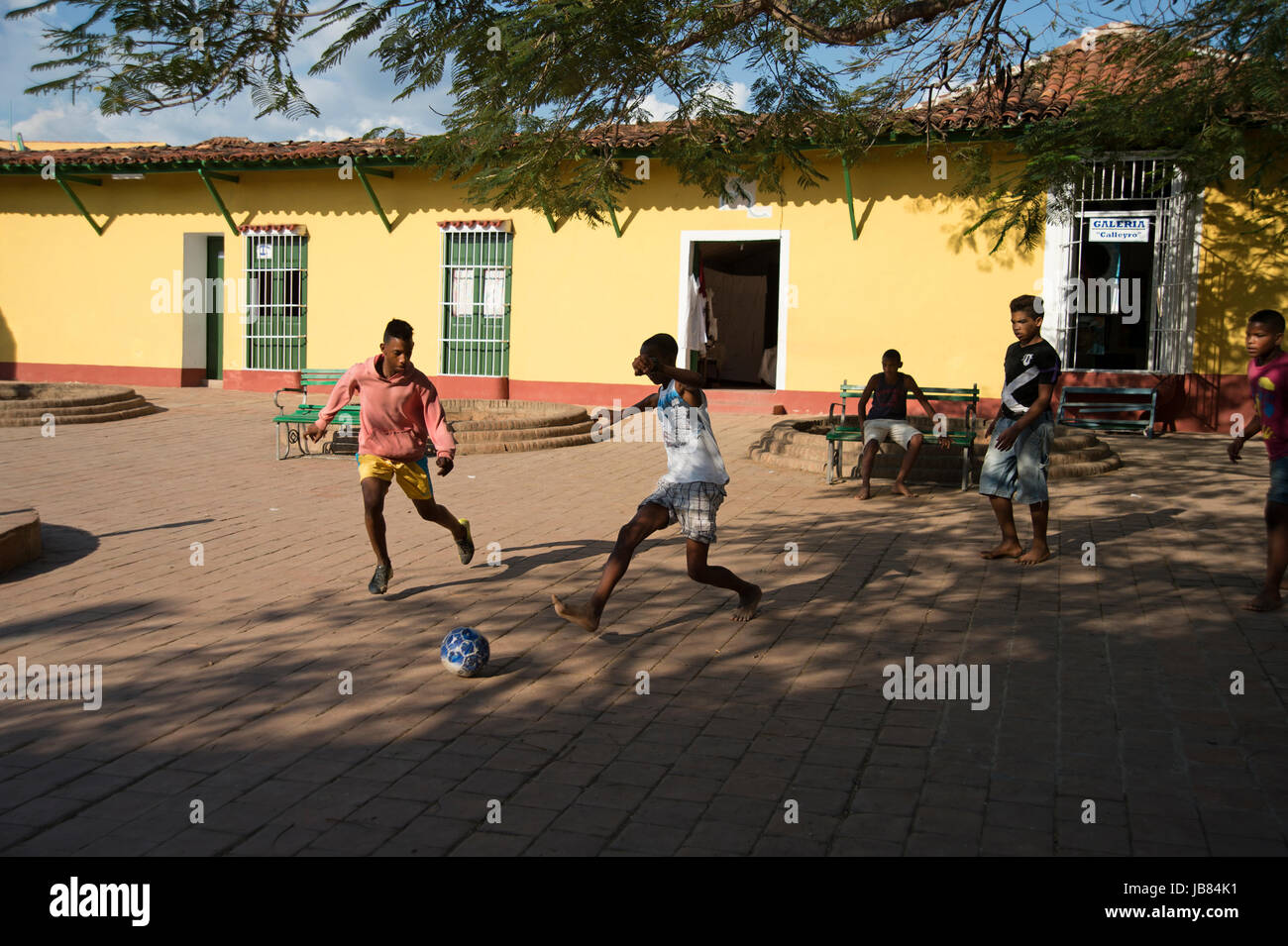 Young Cuban boys playing football in the streets of Trinidad Cuba Stock ...
