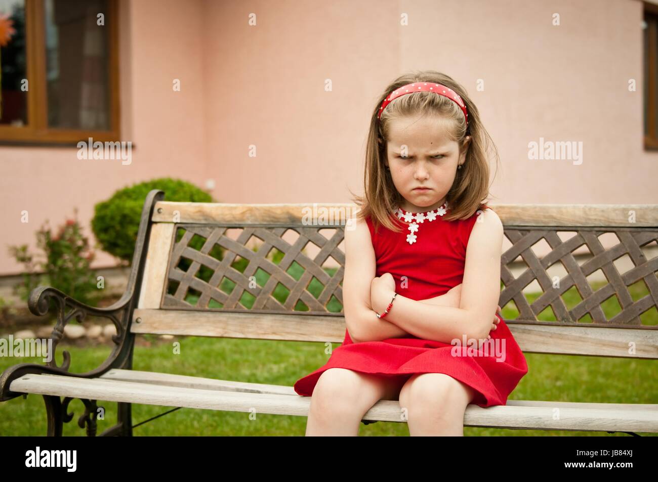 Offended child portrait Stock Photo - Alamy
