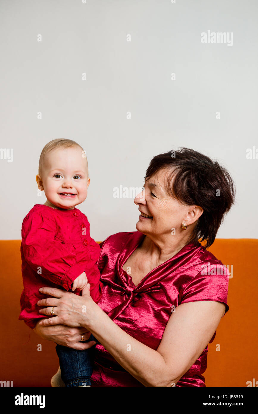 Indoor portrait of grandmother with her grandchild with copy space ...