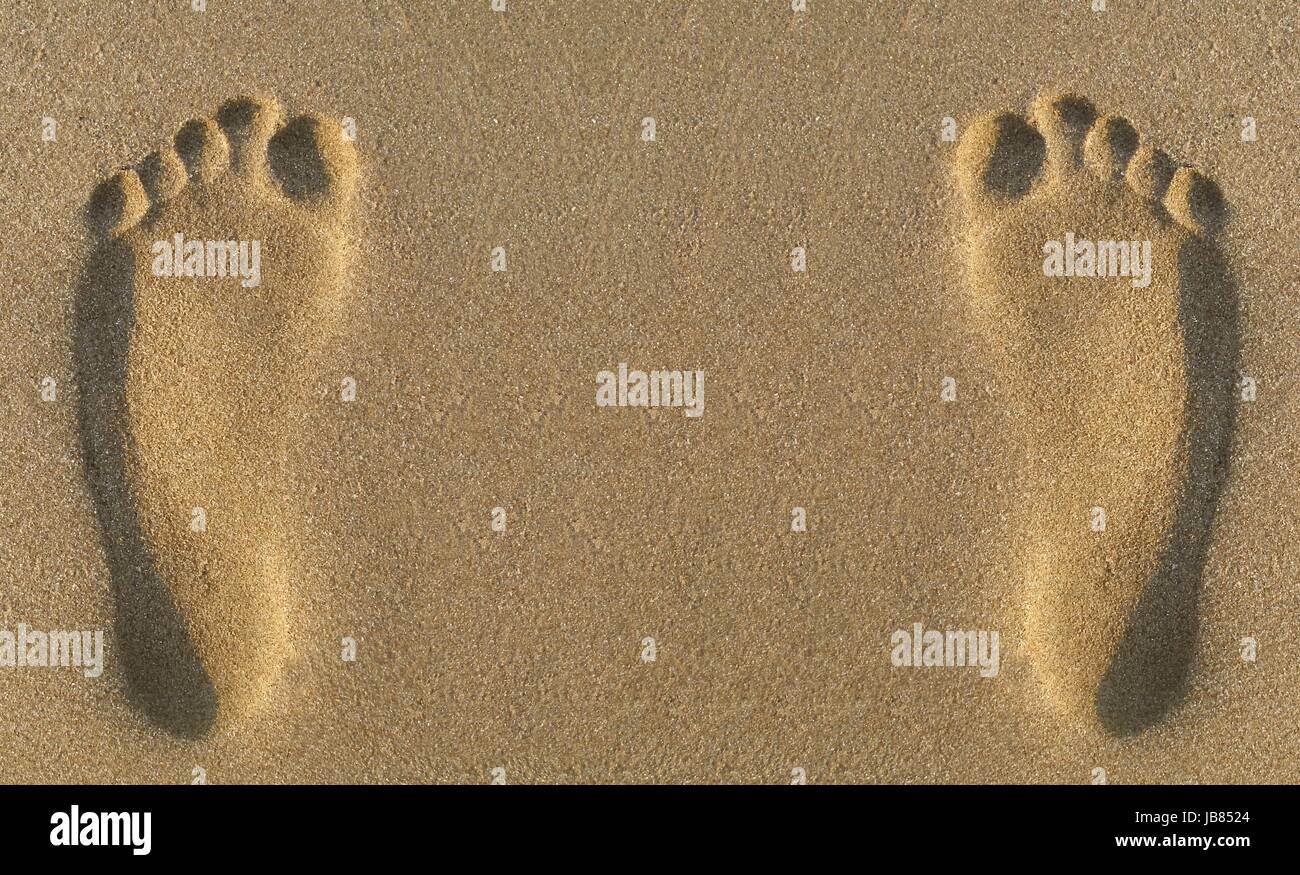 Two parallel footprints in sand Stock Photo - Alamy