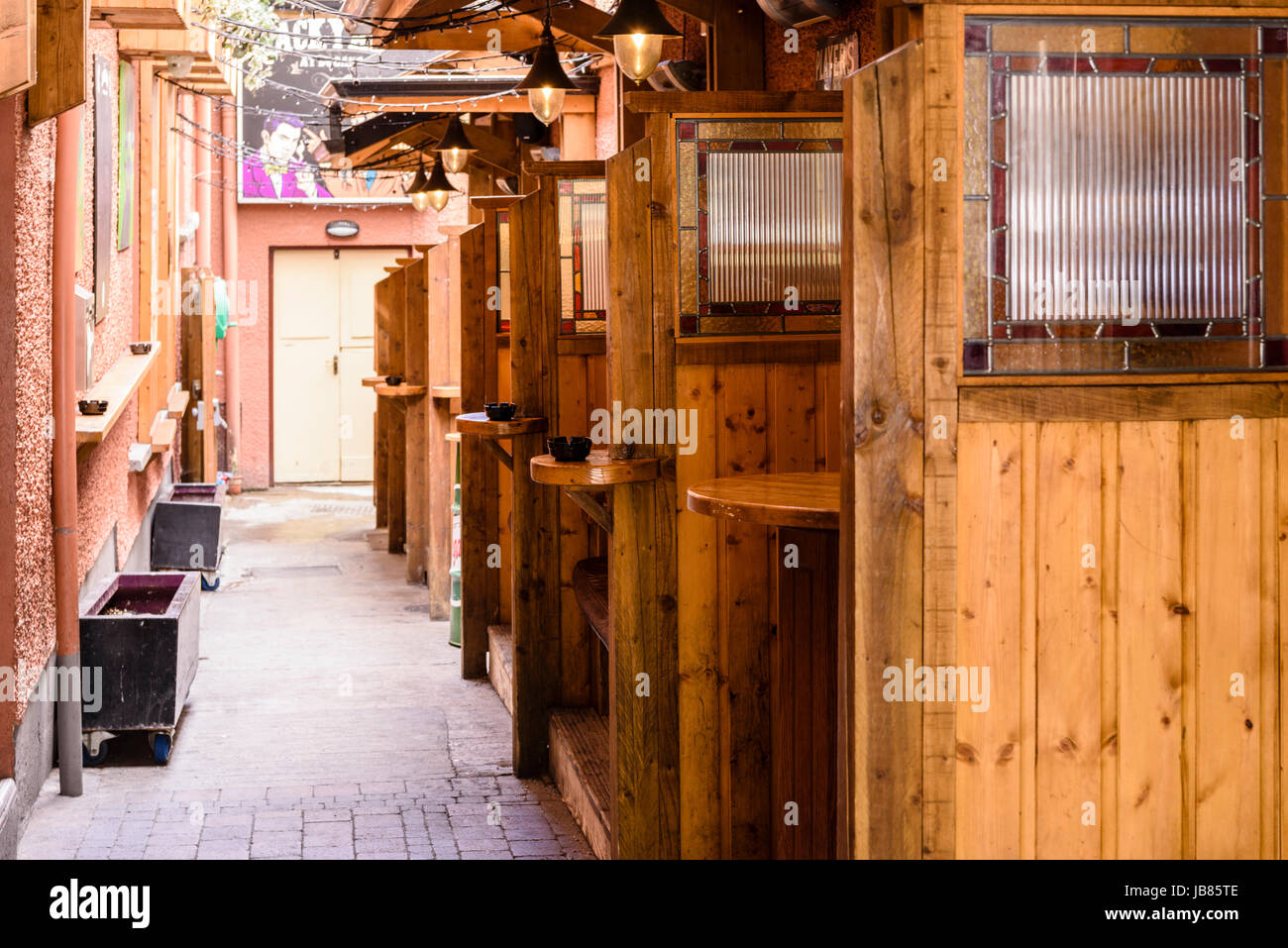 Wooden booths inside a smoking shelter in a pub in Omagh, Northern ...
