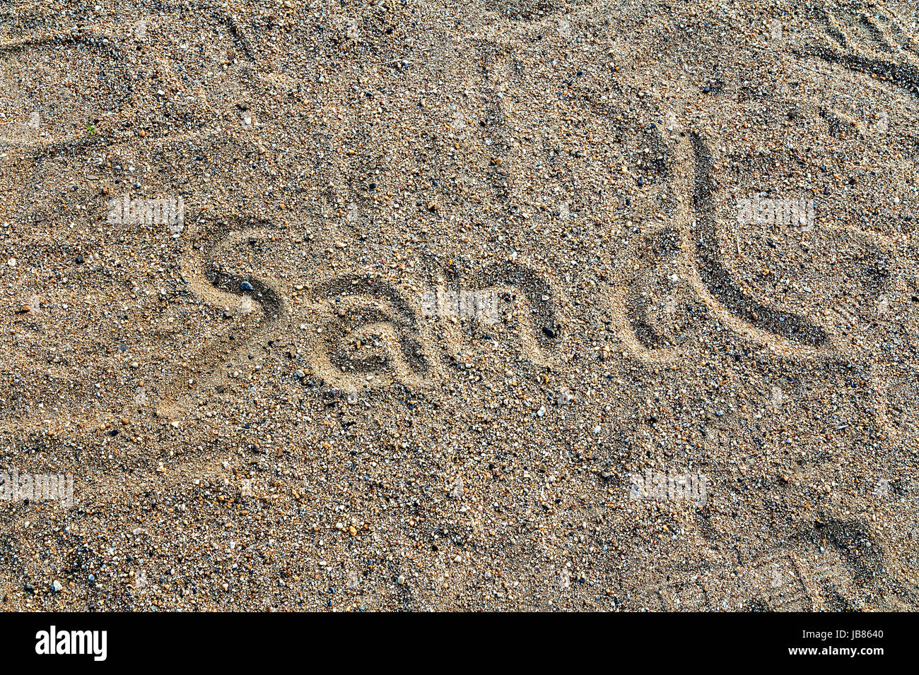 "sand" handwritten in the sand Stock Photo - Alamy