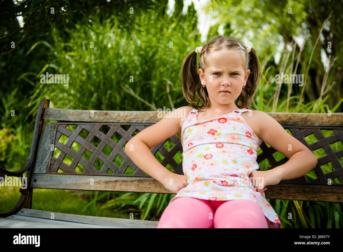 Portrait of small offended child - outoor in backyard Stock Photo - Alamy
