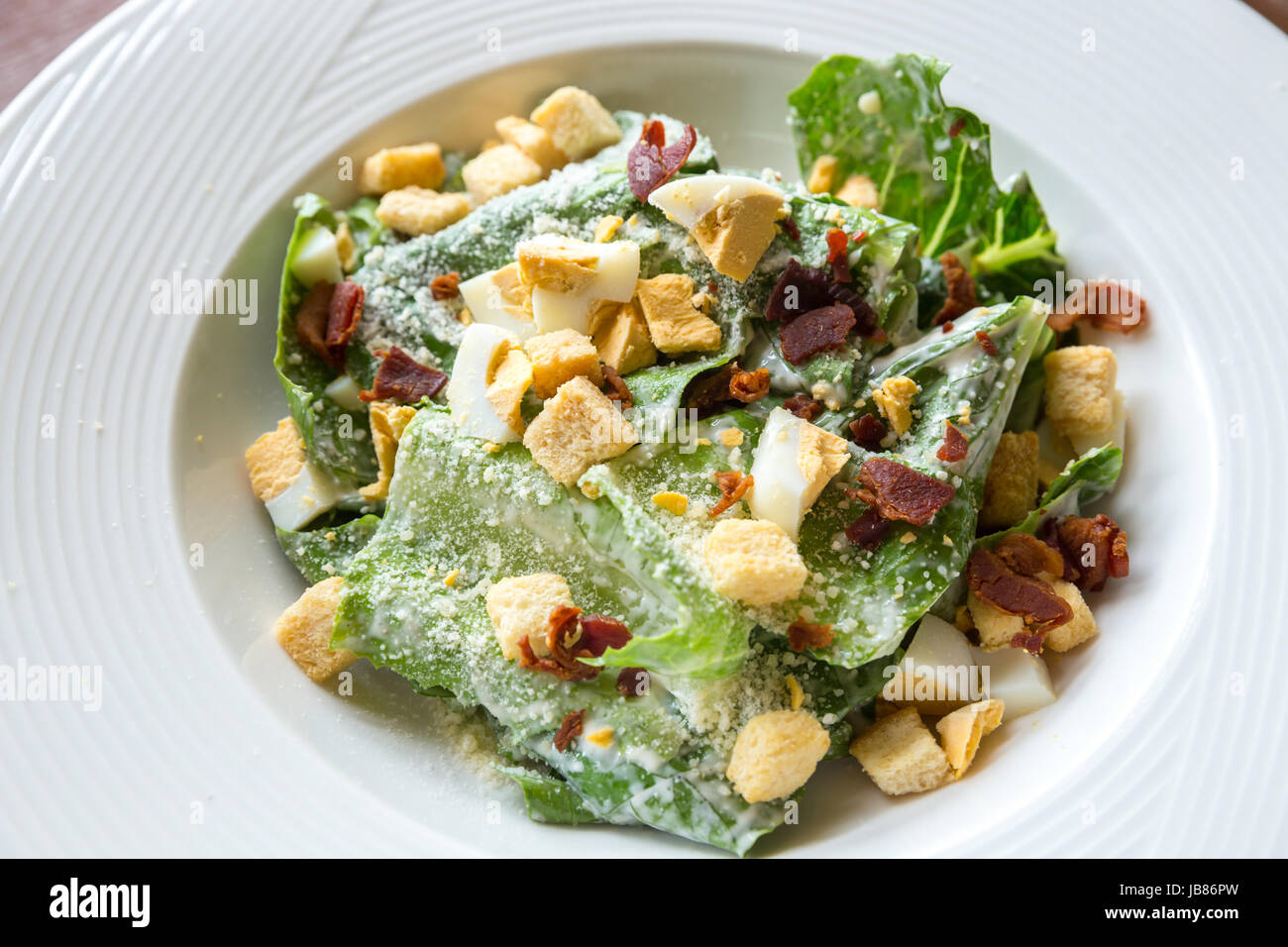 Ceasar Salad with bacon bit Stock Photo - Alamy
