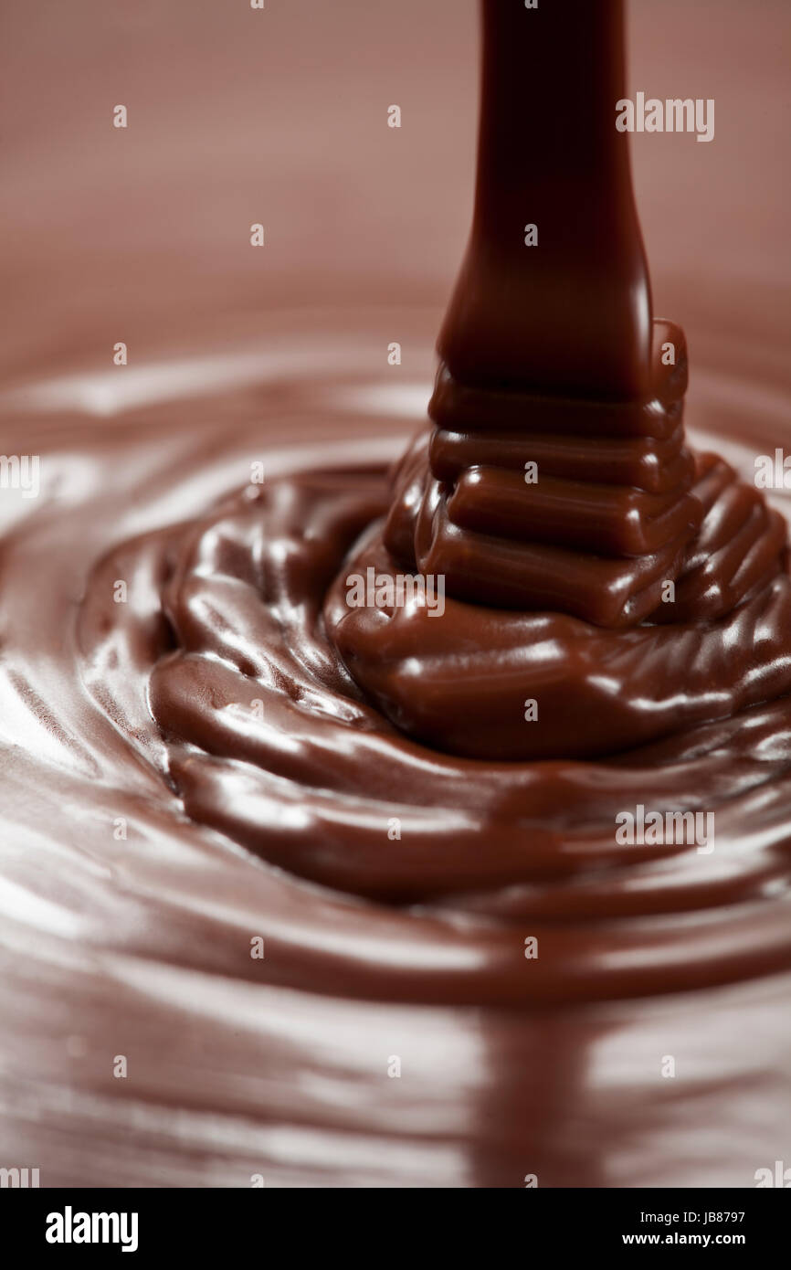 liquid chocolate falling in a pile Stock Photo - Alamy