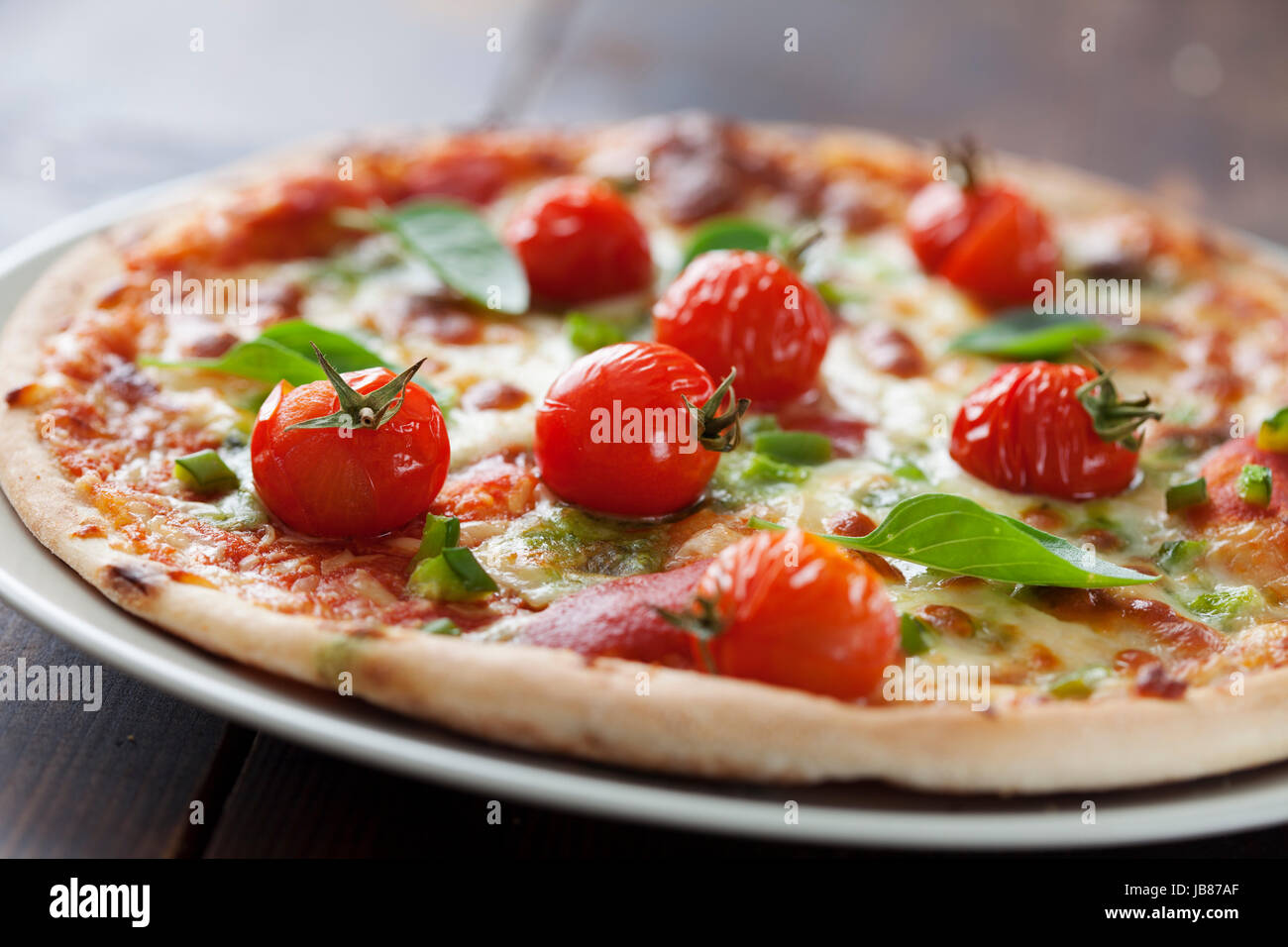 rustic italian pizza with mozzarella, cheese and basil leaves Stock ...