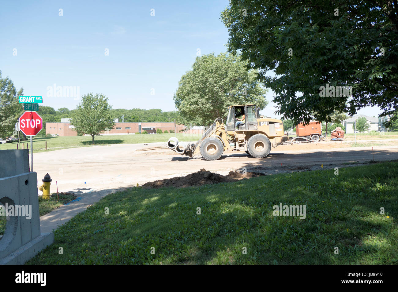 Construction Front Loader Carrying Reinforced Concrete Pipes Stock ...