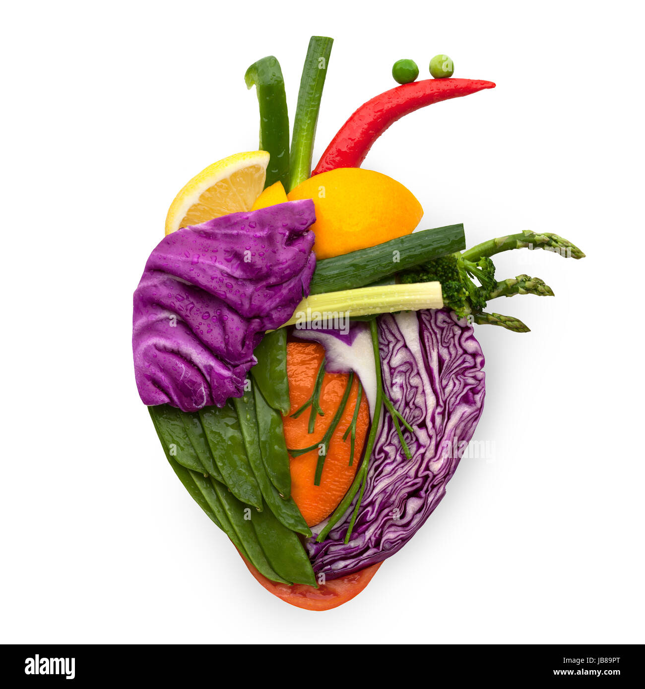 A healthy human heart made of fruits and vegetables as a food concept ...