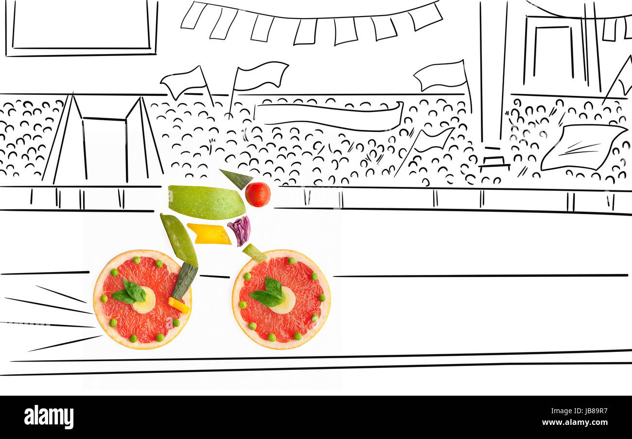 Fruits and vegetables in the shape of a cyclist riding a bike on a ...