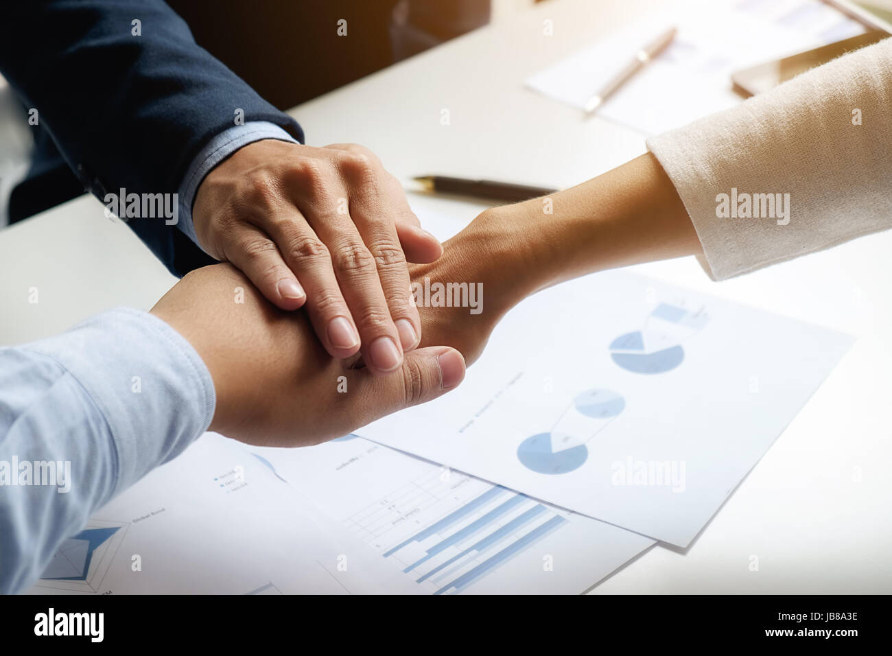 Teamwork join hands support together hi-res stock photography and ...