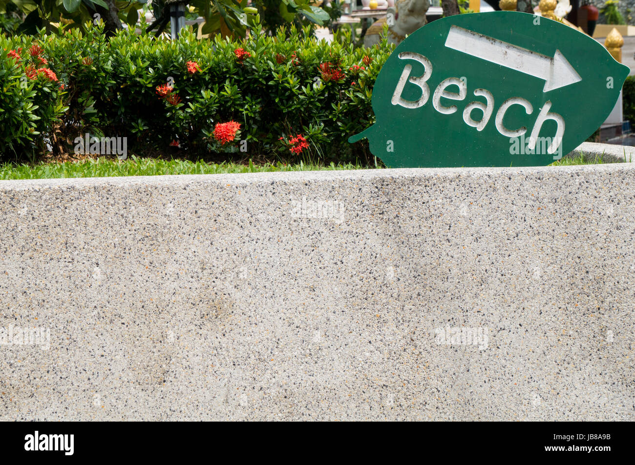 Coconut Beach sign and arrow Stock Photo - Alamy