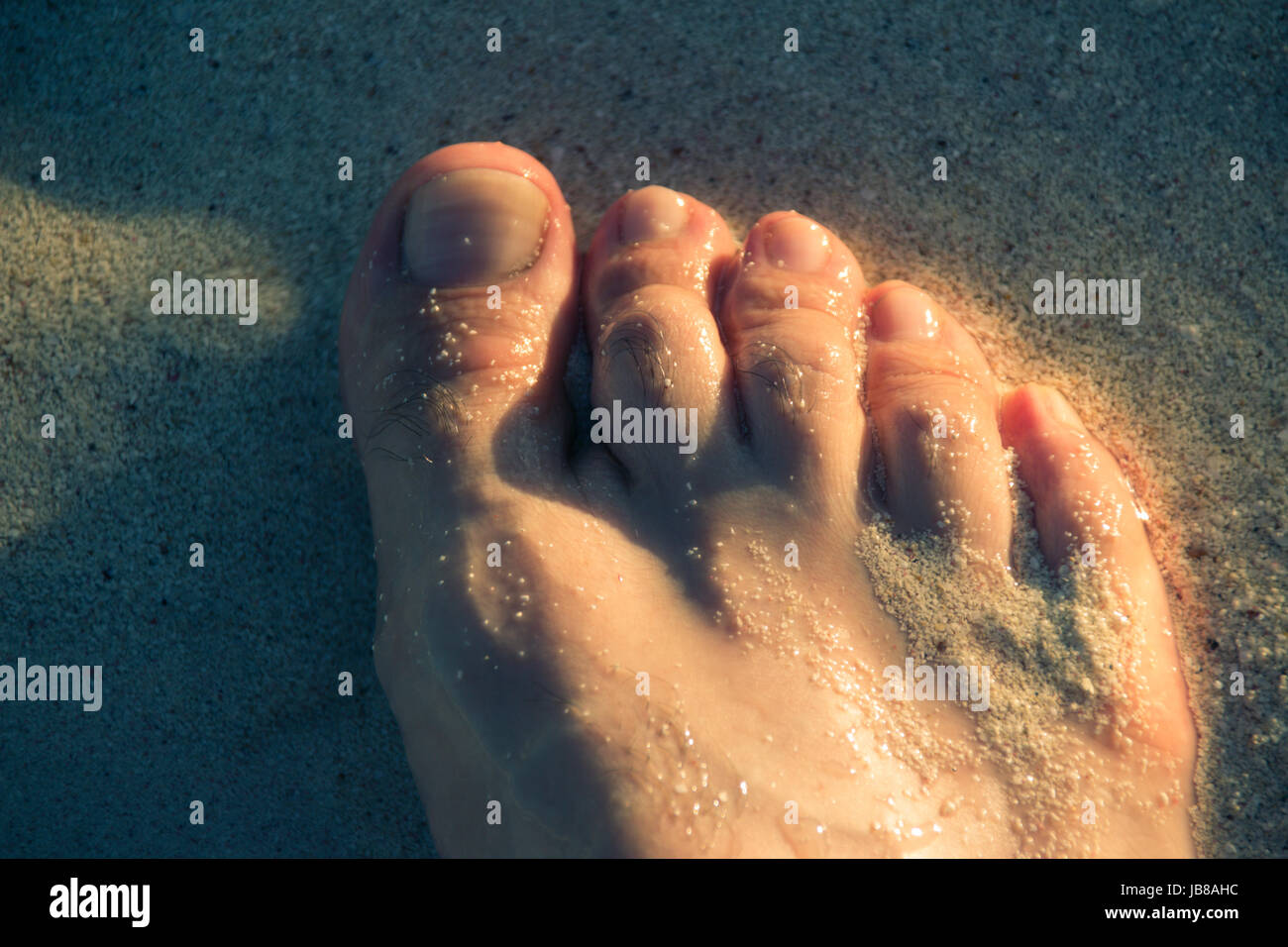 Foot on beach hi-res stock photography and images - Alamy