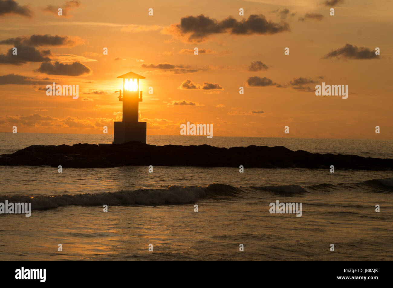 Lighthouse at sunset Stock Photo - Alamy