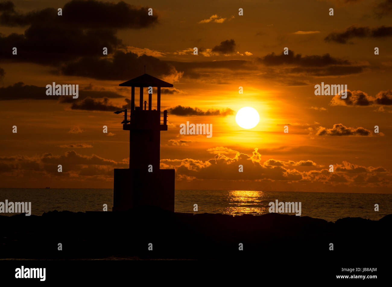 Lighthouse at sunset Stock Photo - Alamy