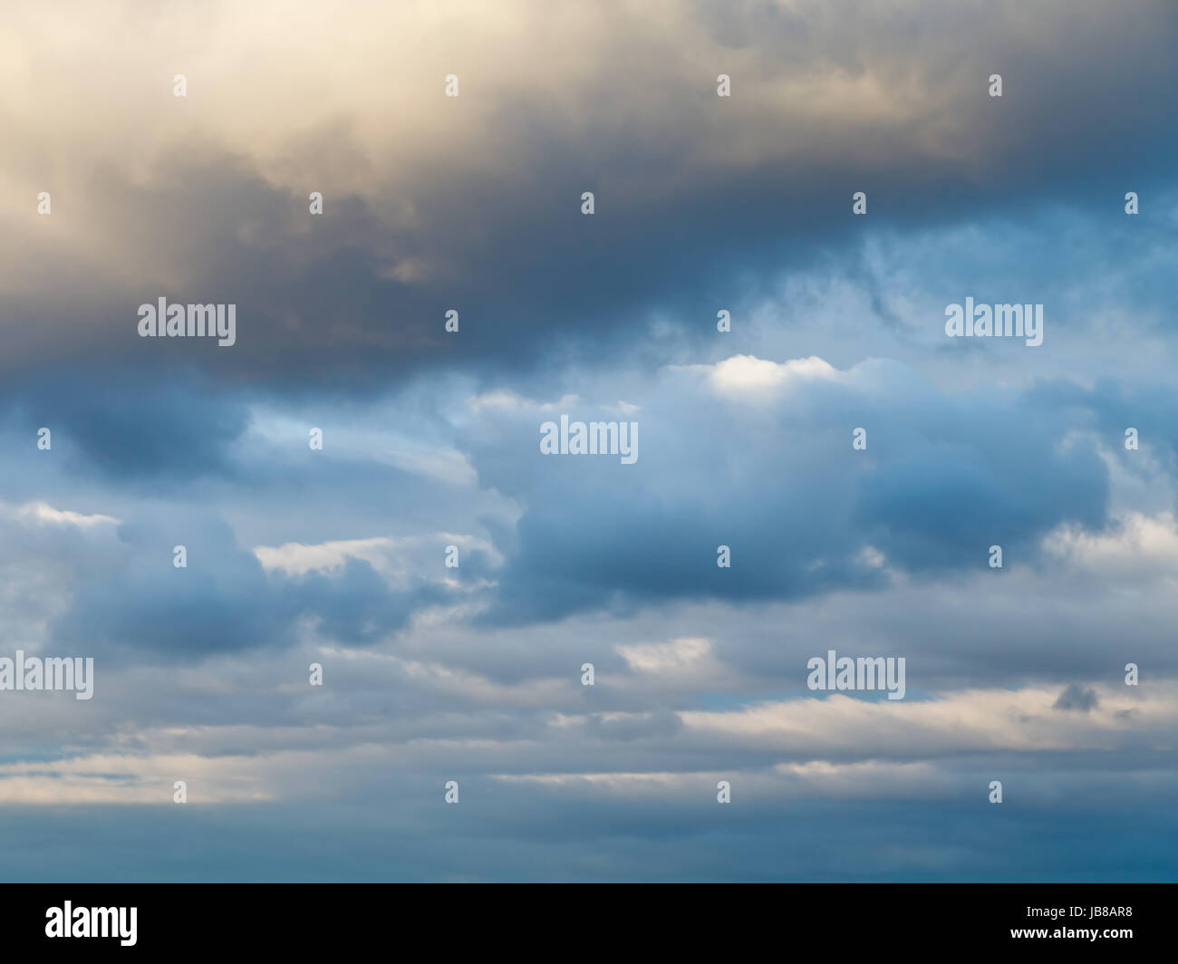 blue winter evening sky with layers of cumulus clouds Stock Photo - Alamy