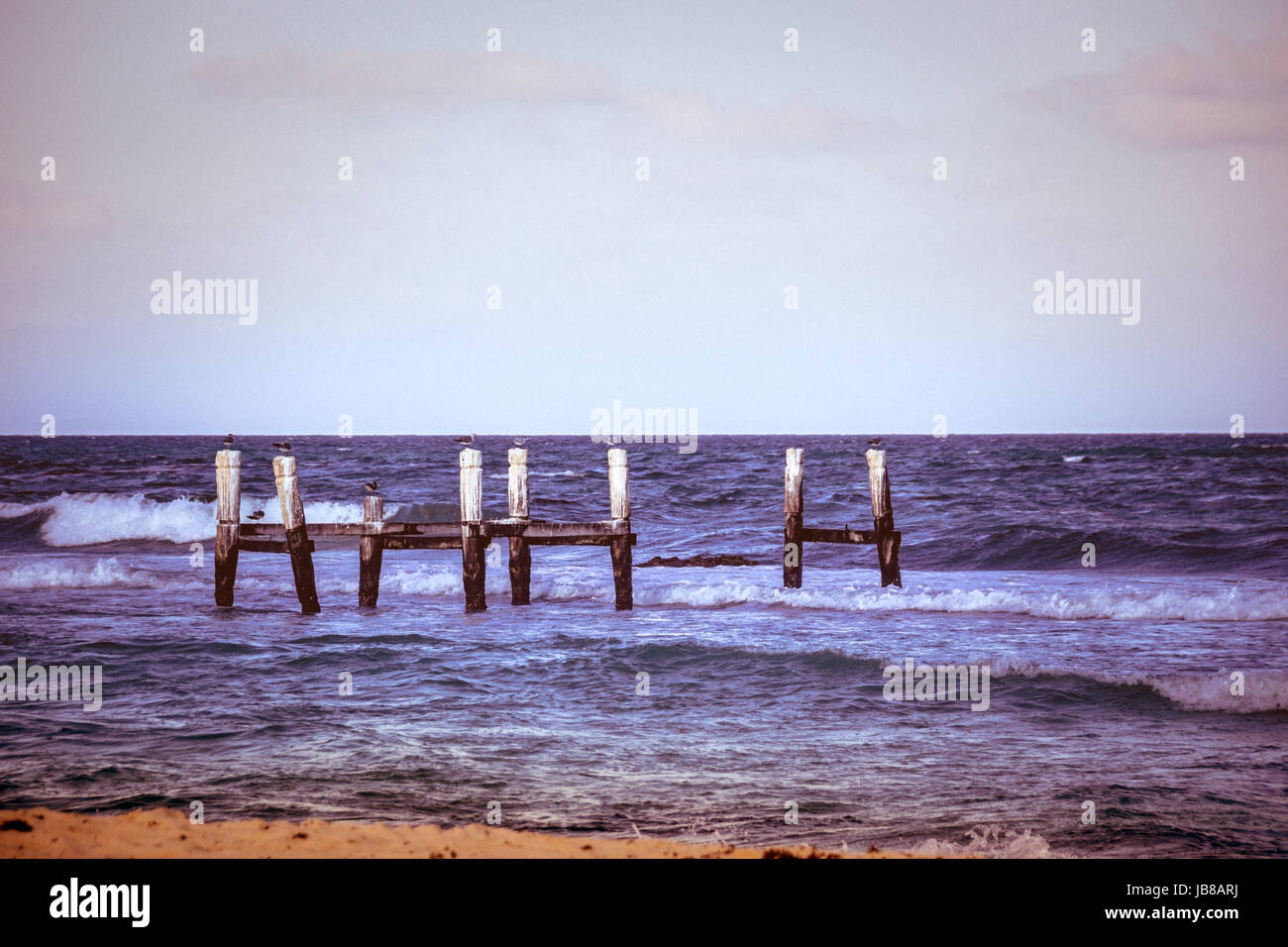 Photograph of an old dock in the ocean Stock Photo - Alamy