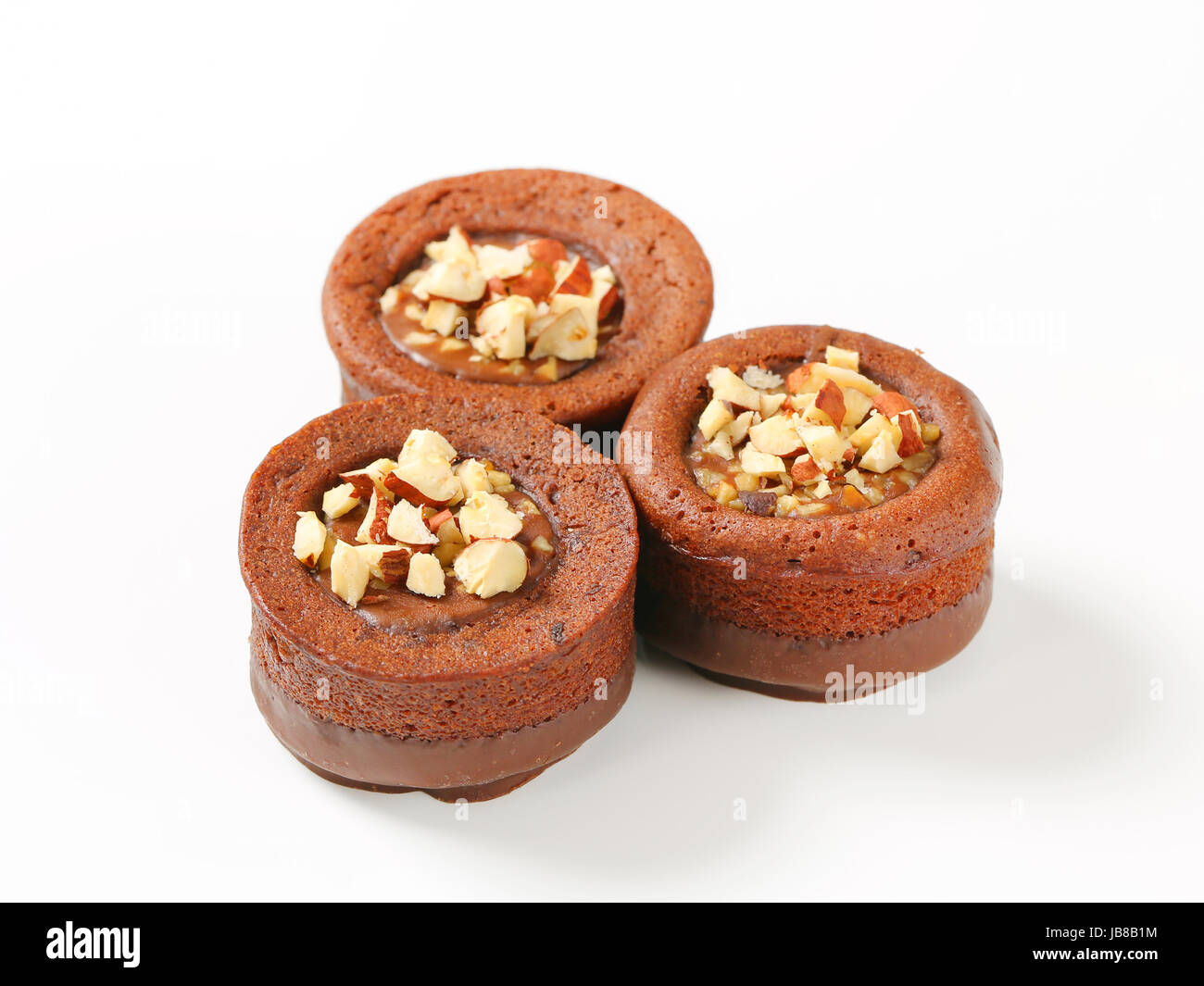 Mini chocolate cakes with hazelnut filling Stock Photo - Alamy