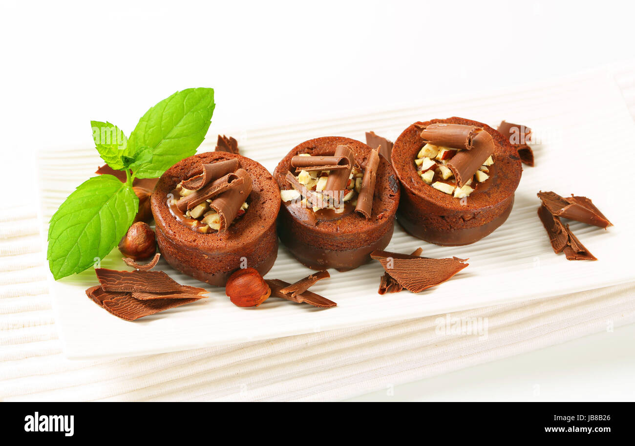 Mini chocolate cakes with hazelnut filling Stock Photo - Alamy