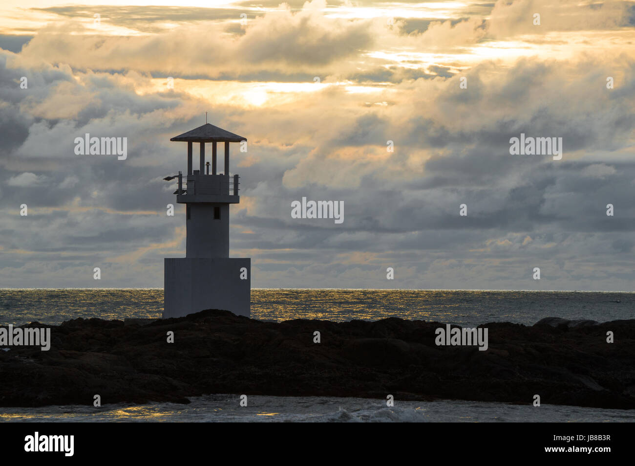 Light beacon at sunset Stock Photo - Alamy