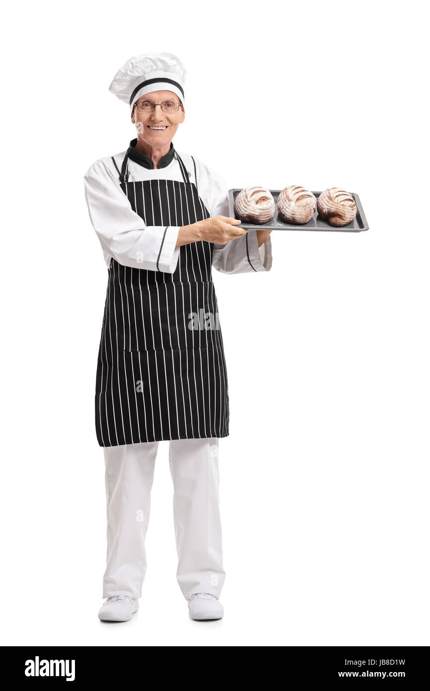 Full length portrait of a baker holding a tray with loaves of bread ...