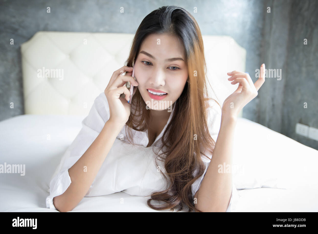 Asian Woman Smile Feel Carefree And She Lying On The Bed In The Morning