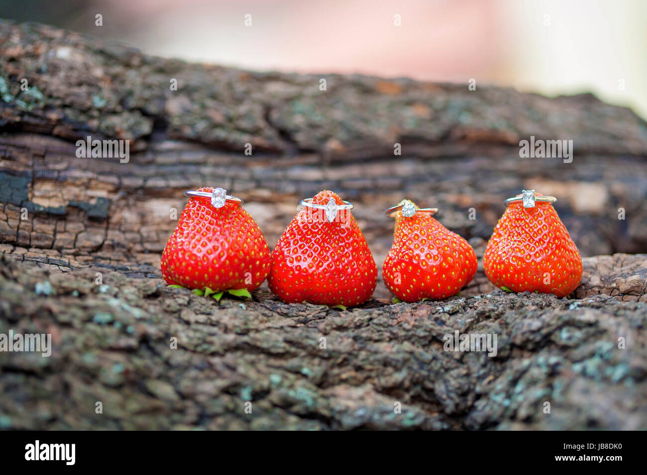 Sweet strawberry wedding rings Stock Photo - Alamy
