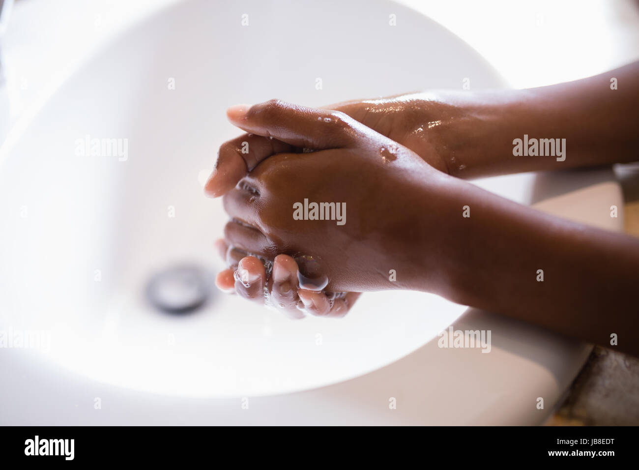 Person washing hi-res stock photography and images - Alamy