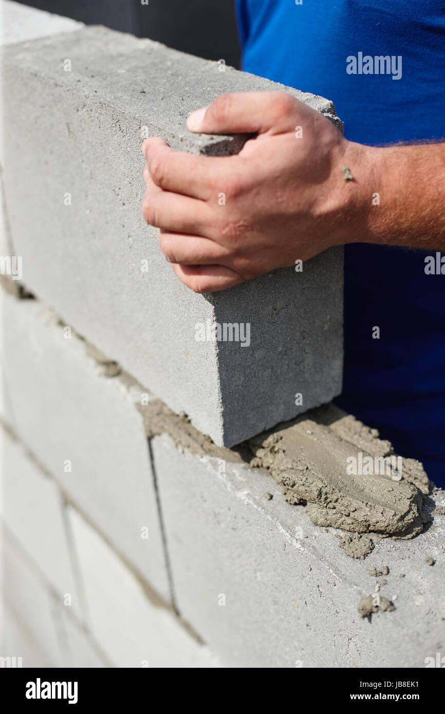 Builder laying bricks close up hi-res stock photography and images - Alamy