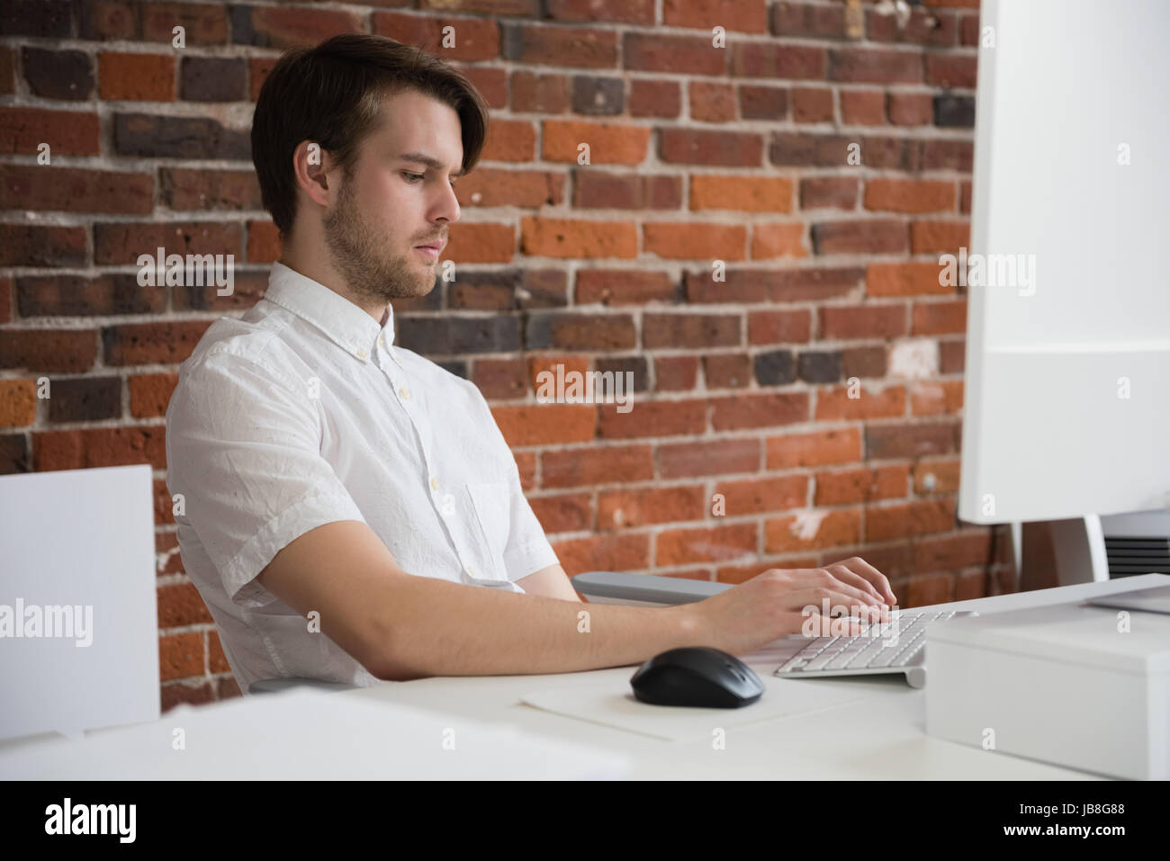 Attentive executive working on computer in office Stock Photo - Alamy